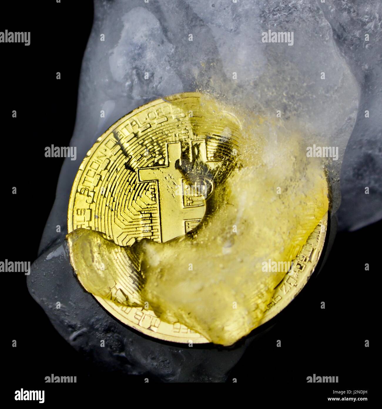 Physical cryptocurrency coin frozen Stock Photo - Alamy