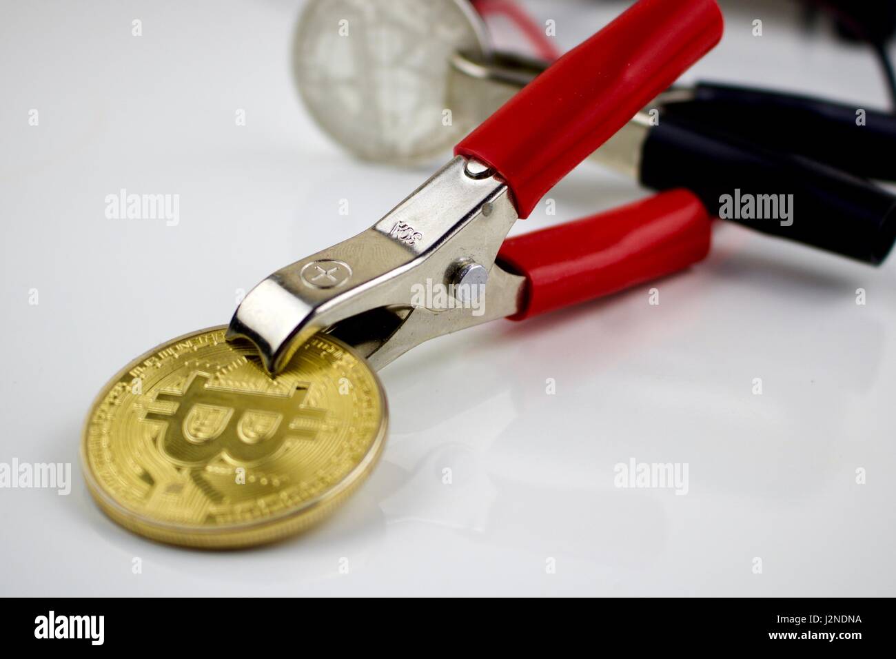 Gold cryptocurrency physical coin with electrical cables Stock Photo ...