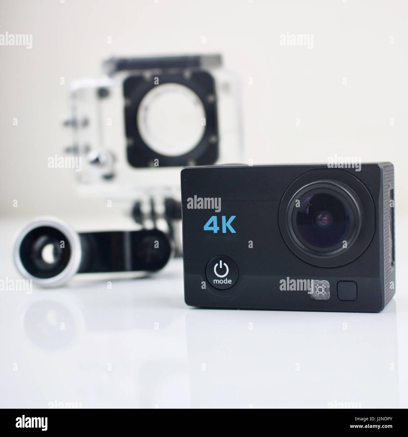 Black small sport camera 4K with equipment Stock Photo - Alamy