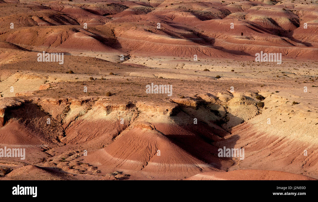 The arid desert landscape and striking geological formations of the ...