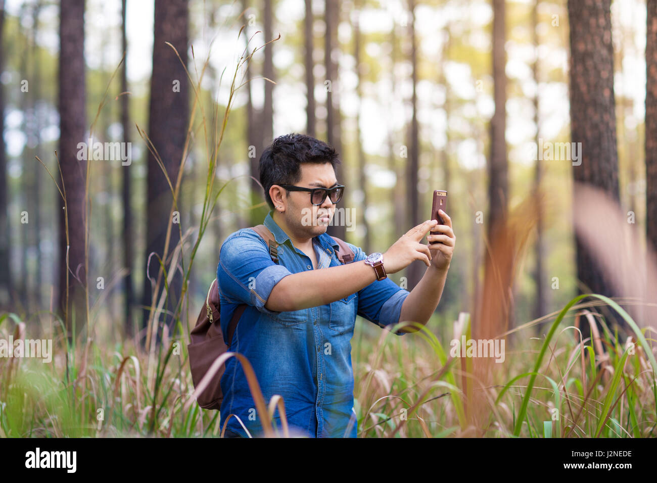 A man with his mobile smart phone searching for reception signal in the ...