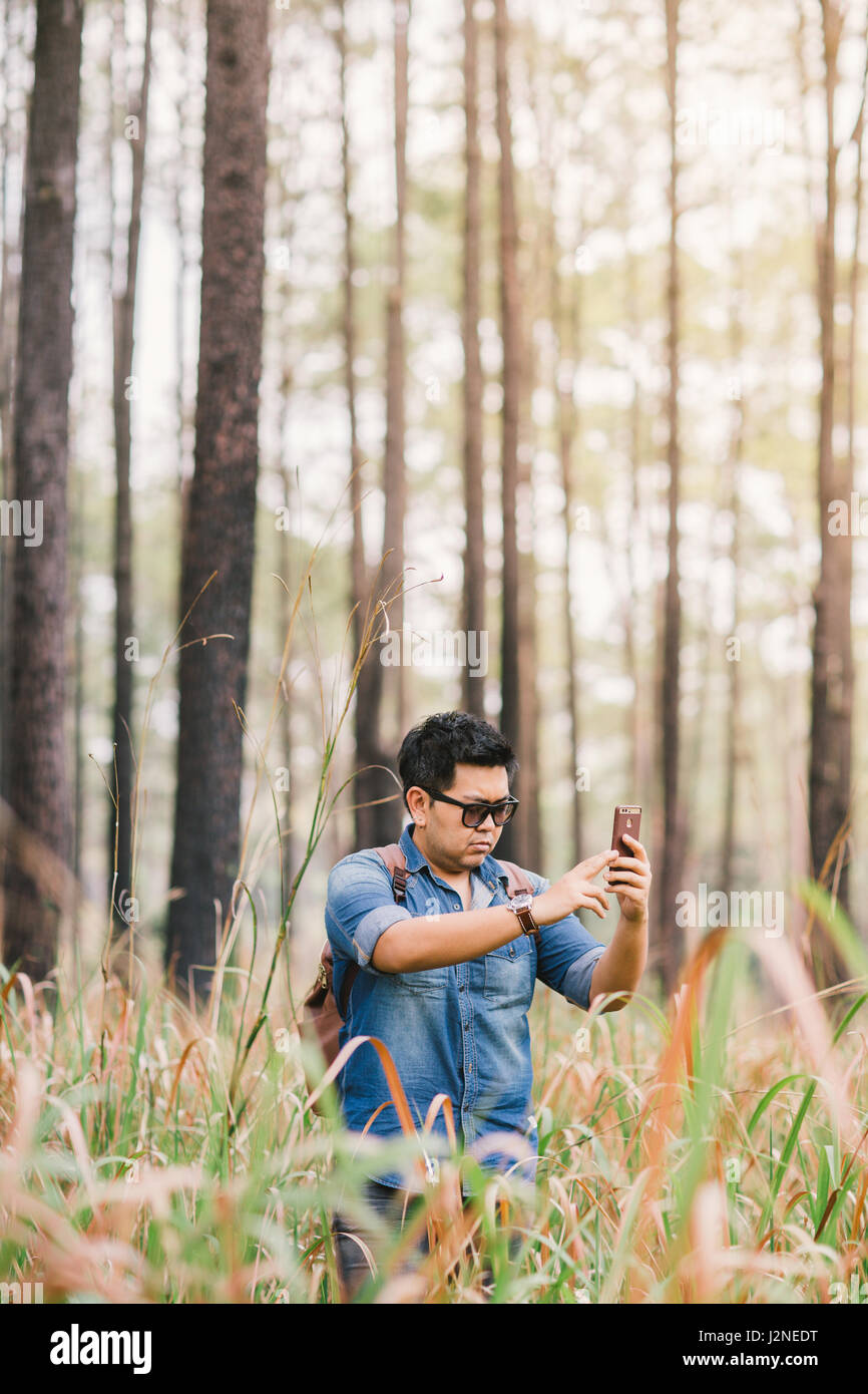 A man with his mobile smart phone searching for reception signal in the ...