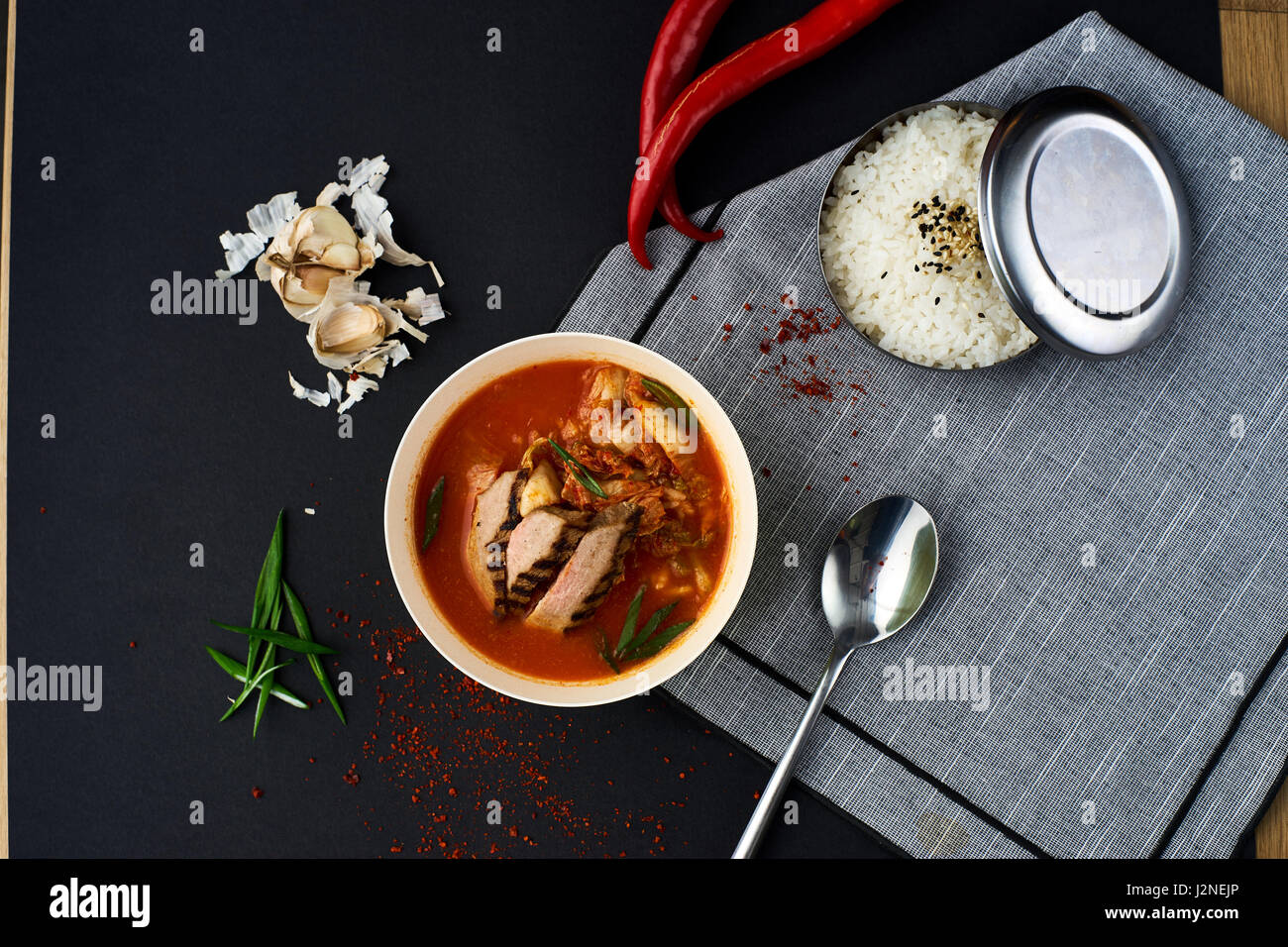 Korean cuisine. Kimchi soup on black background Stock Photo - Alamy