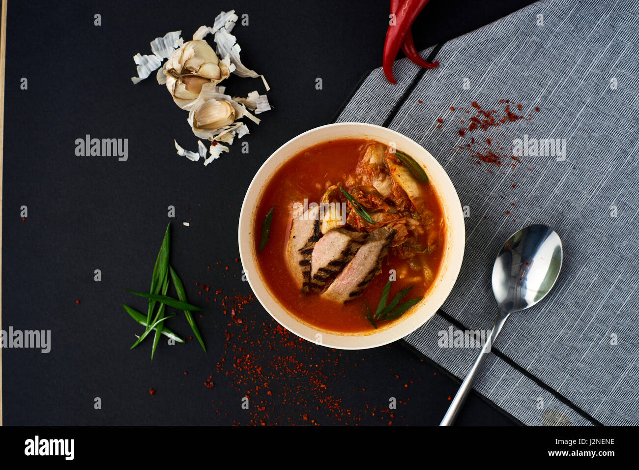 Korean cuisine. Kimchi soup on black background Stock Photo - Alamy