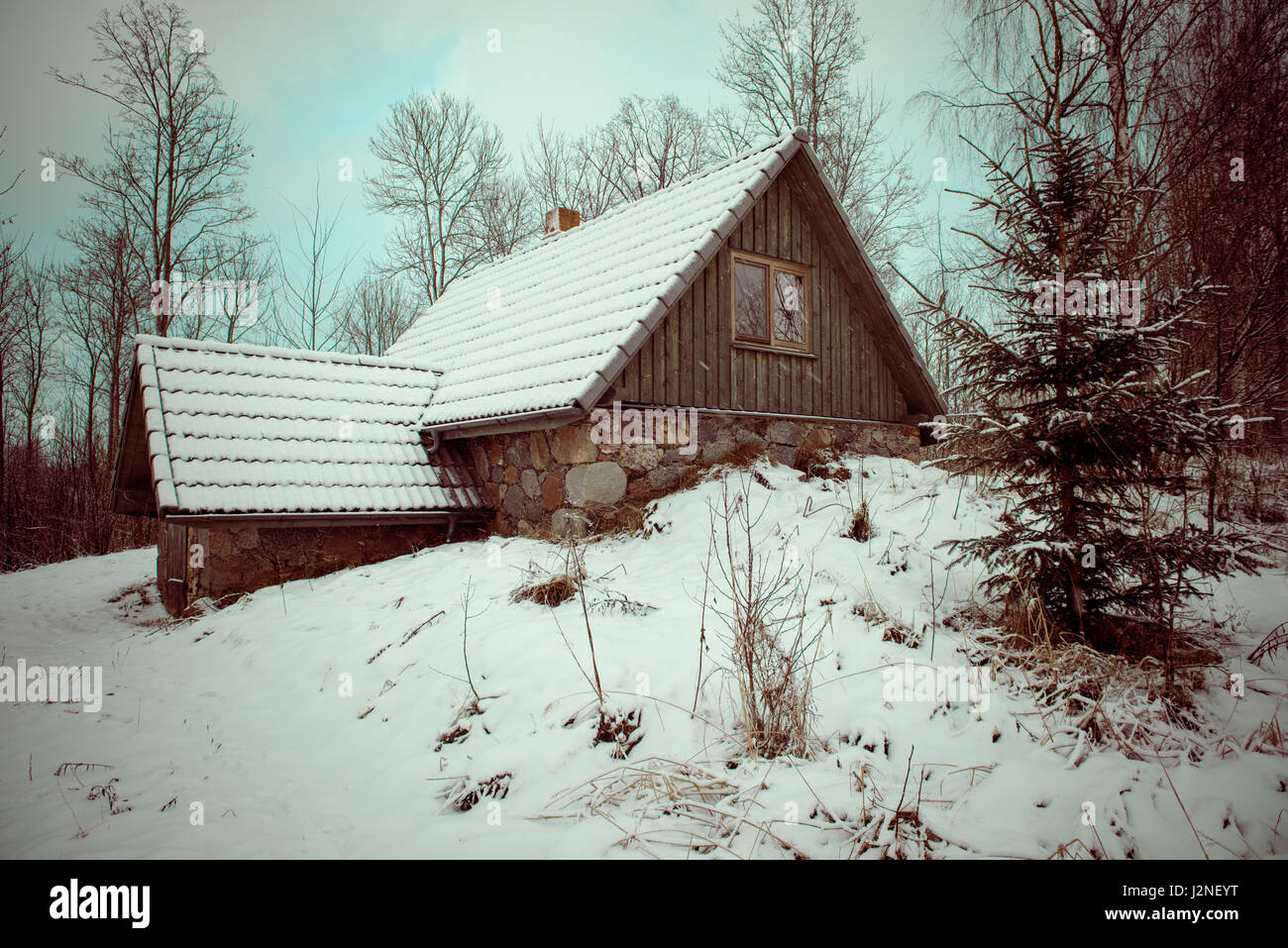 small rural cottage in winter in countryside - retro vintage look Stock ...