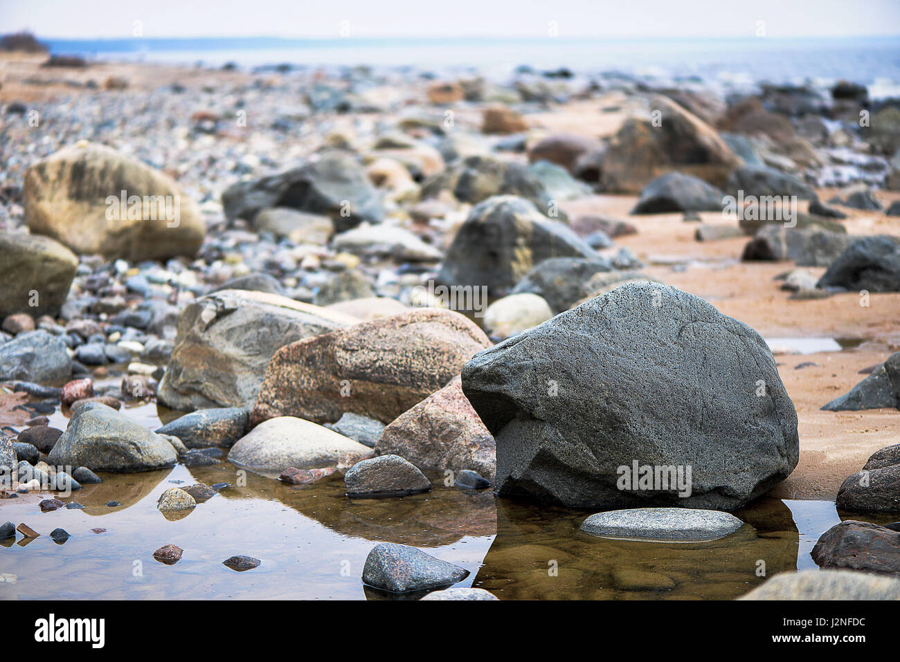 Close-up photography. Full sea edge with colored stones Stock Photo - Alamy