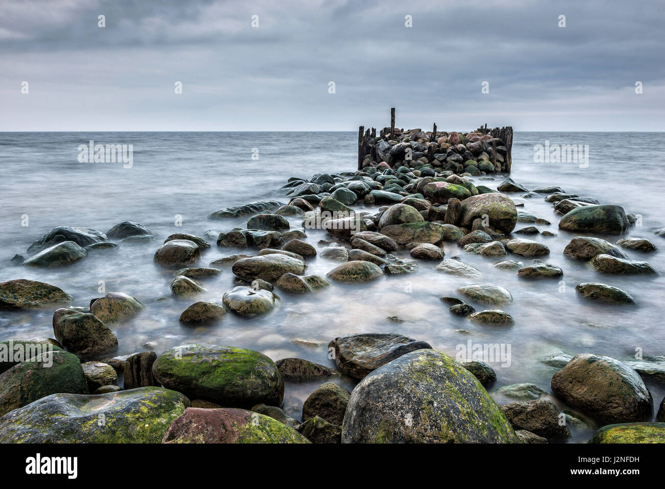 Marine waters surrounded by the old stone mole Stock Photo - Alamy