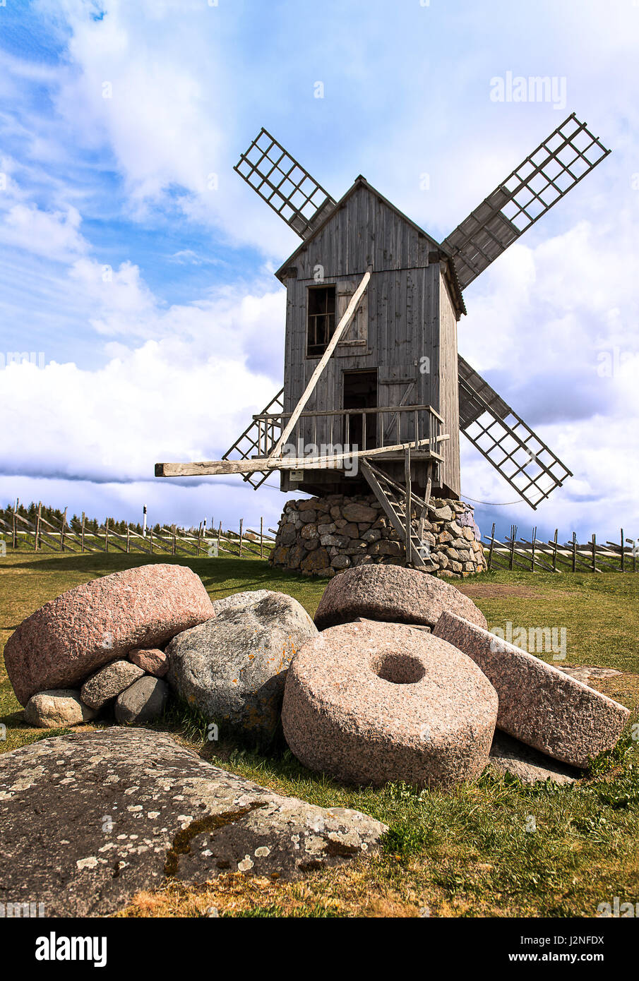 Rural landscape with old mills and millstones Stock Photo - Alamy
