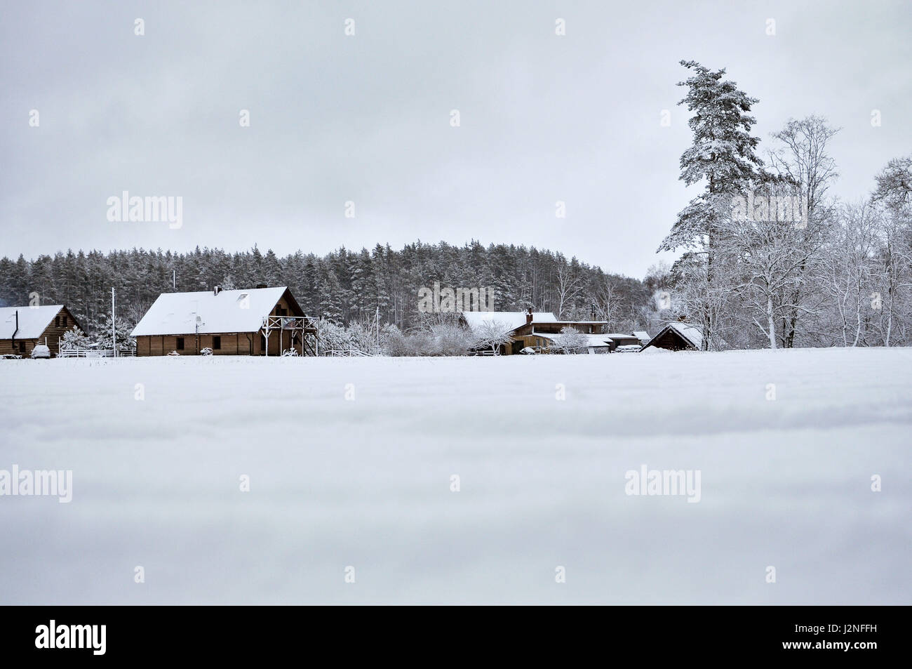 Cold snowy winter landscape of rural homes Stock Photo - Alamy