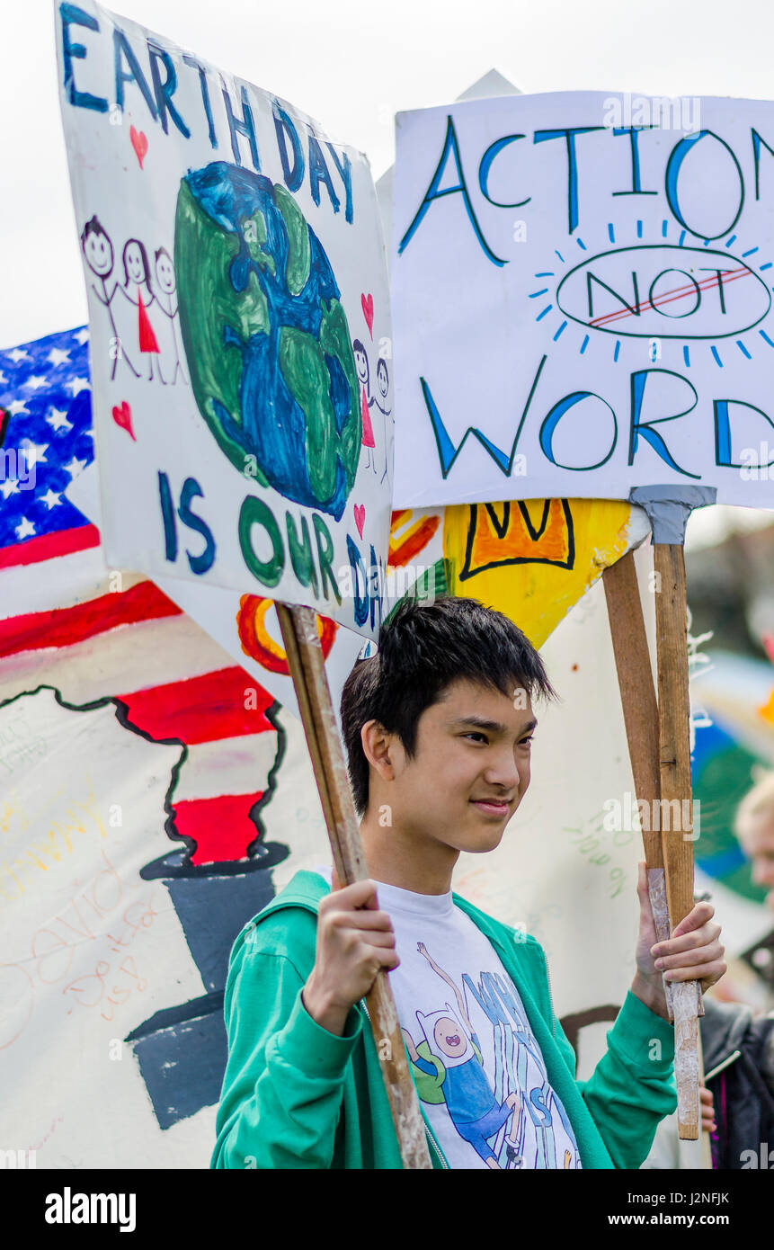 Teen with signs at Earth Day Parade, Vancouver, British Columbia ...