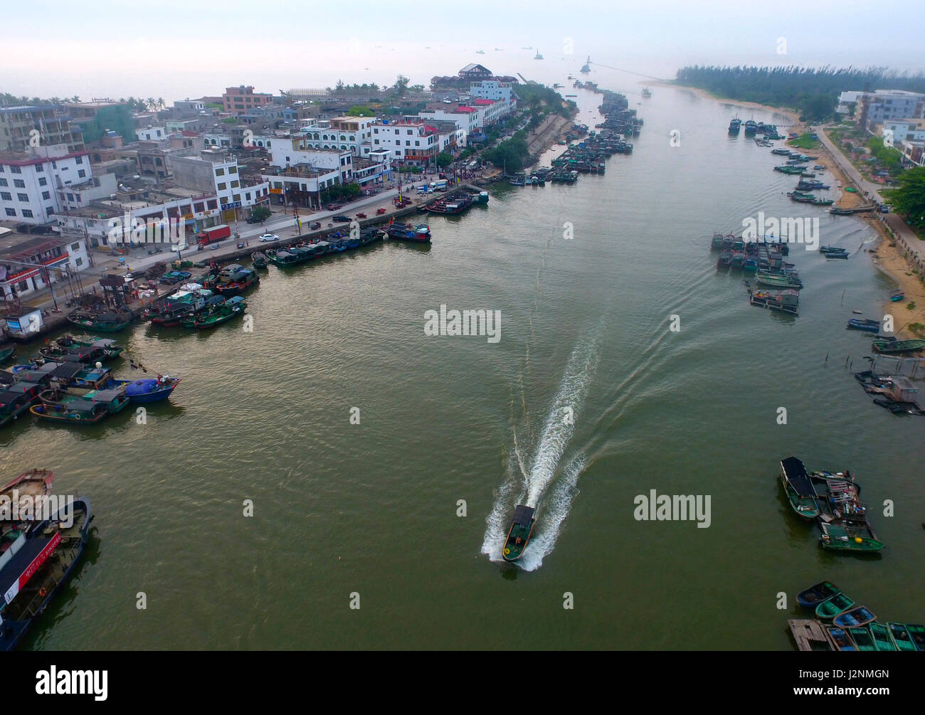 Qionghai, China's Hainan Province. 30th Apr, 2017. Fishing boats return ...