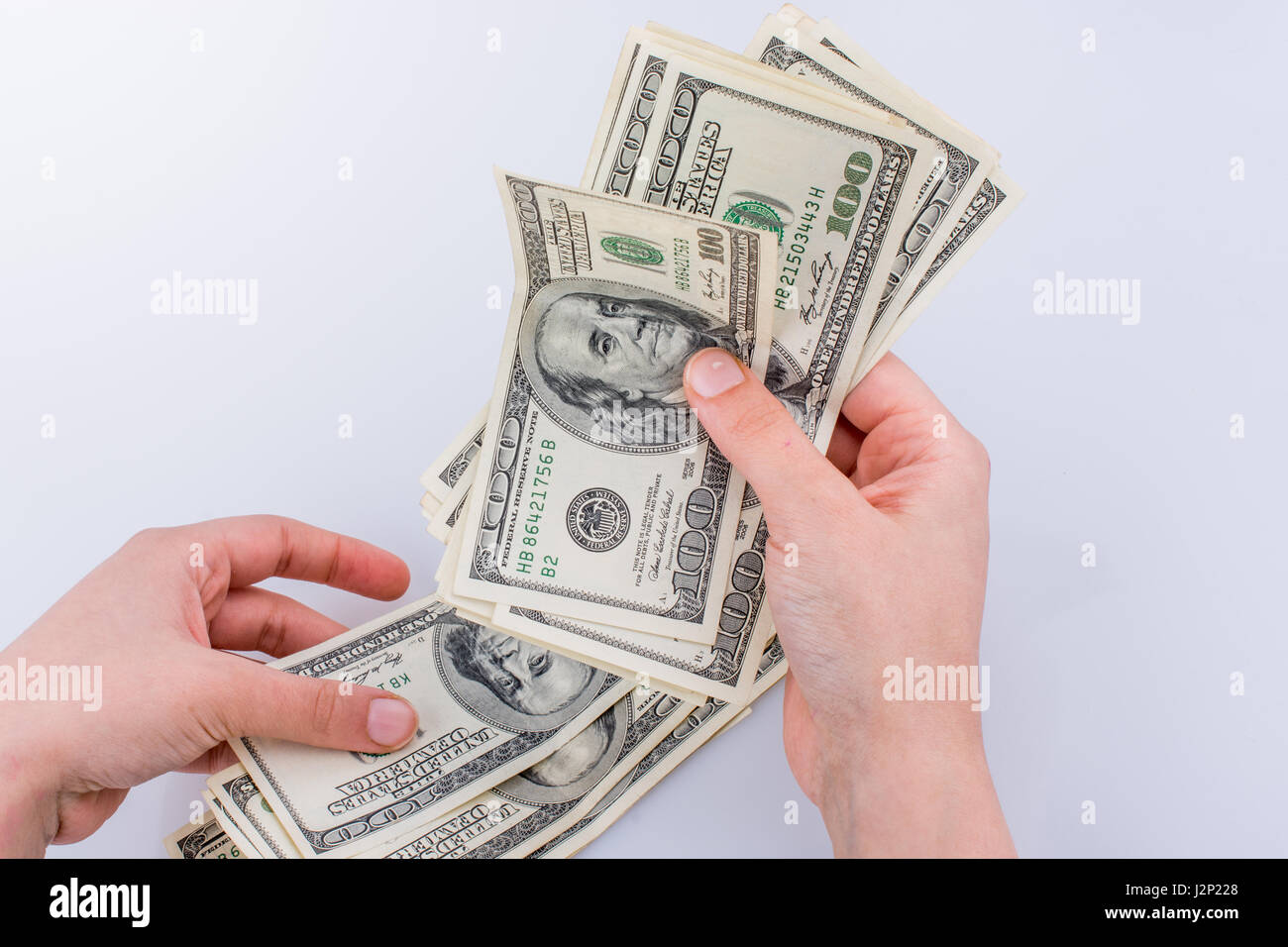 Human hand holding American dollar bill as money isolated on white ...