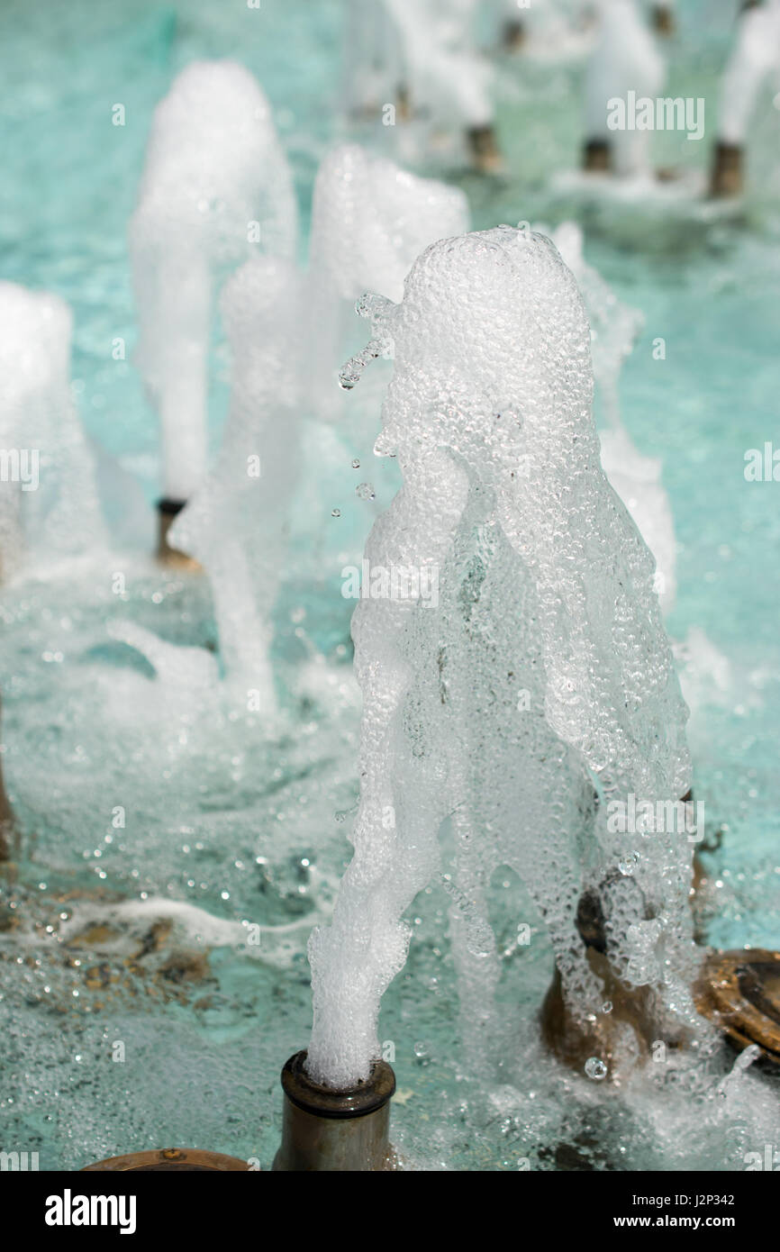 The fountains gushing sparkling water in a pool in a park Stock Photo ...