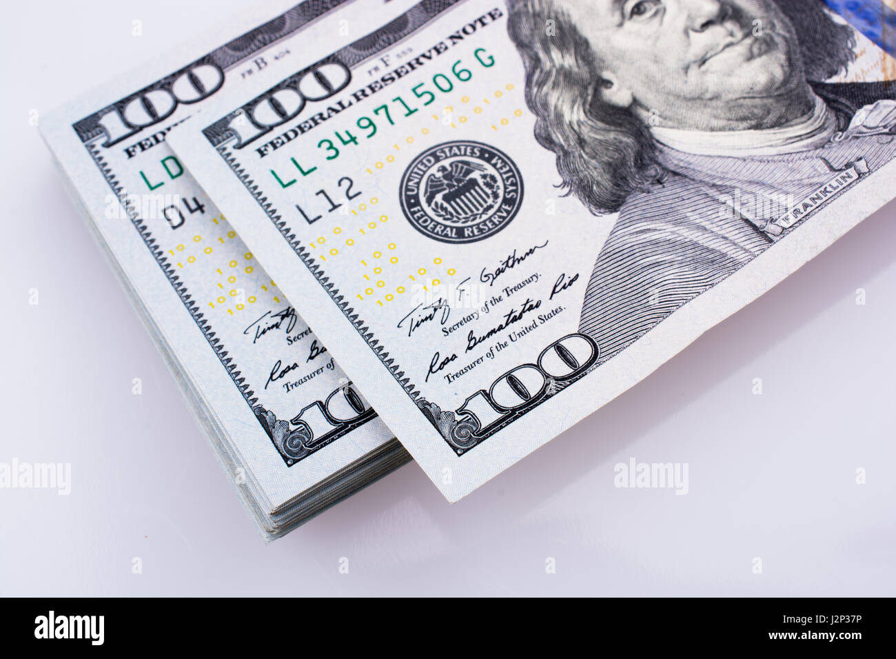 American 100 dollar banknotes made of paper placed on white background ...