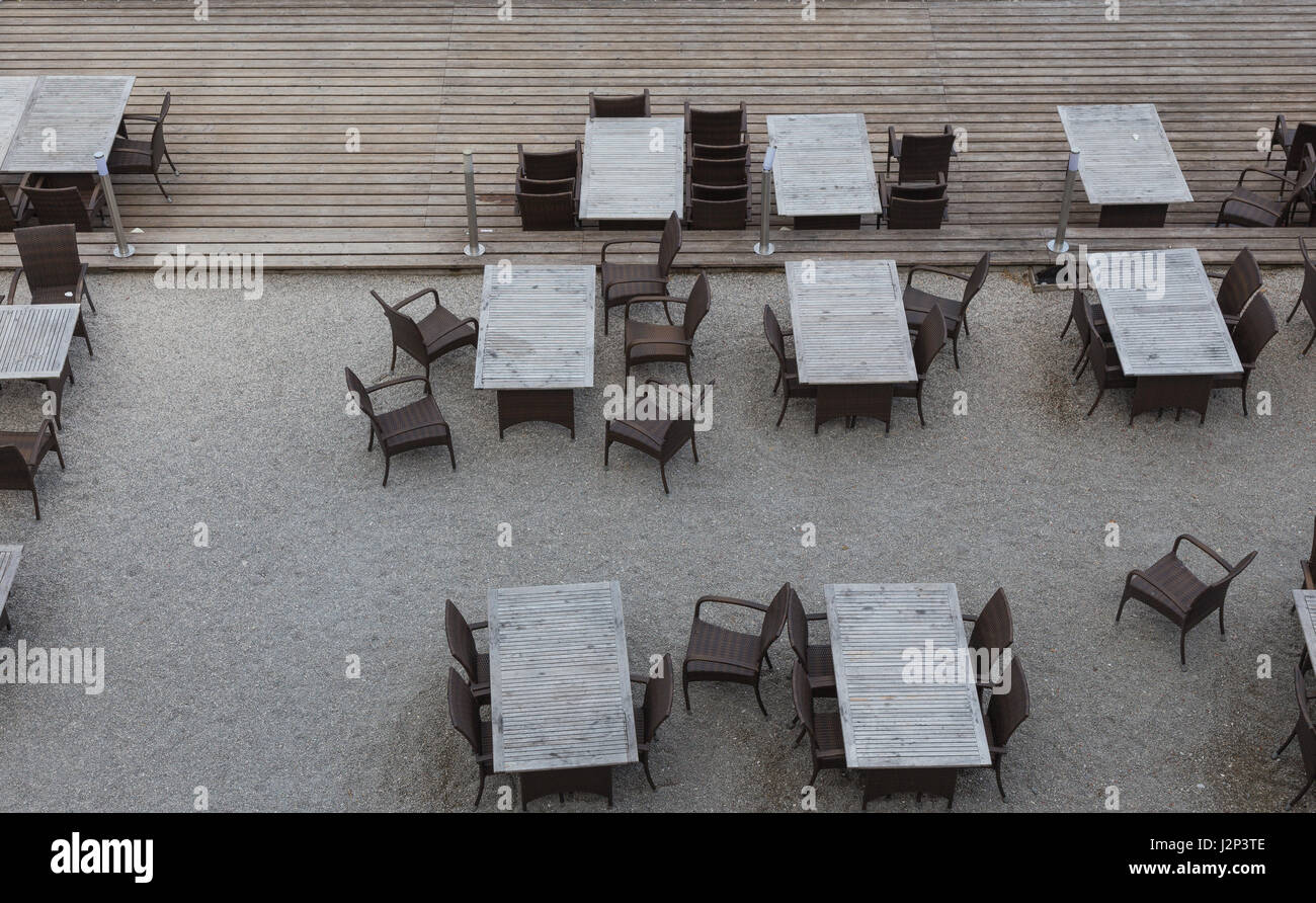 looking down view of empty outdoor restaurant tables and chairs Stock ...