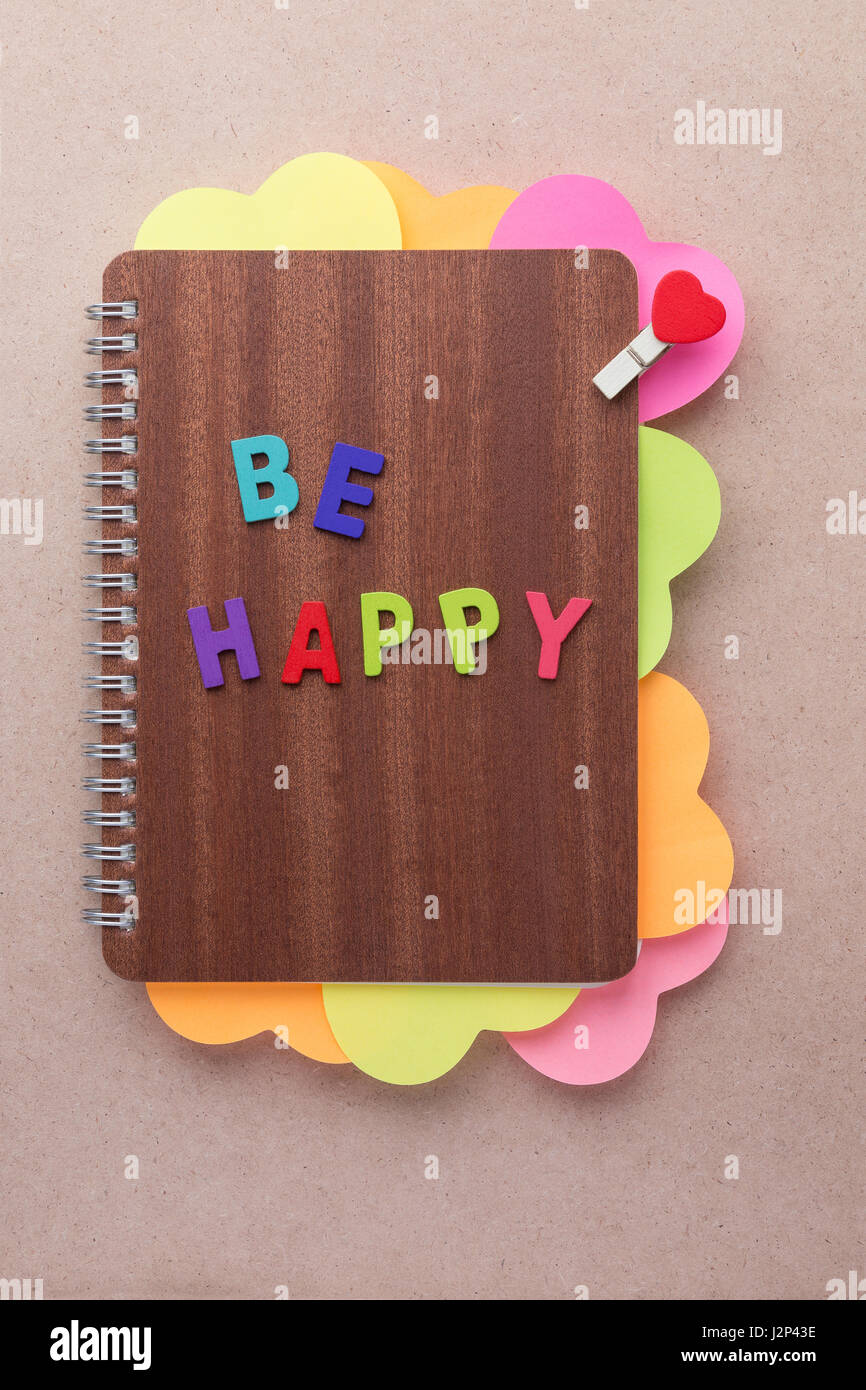 Be Happy wording on a notebook with many colorful hearts Stock Photo ...