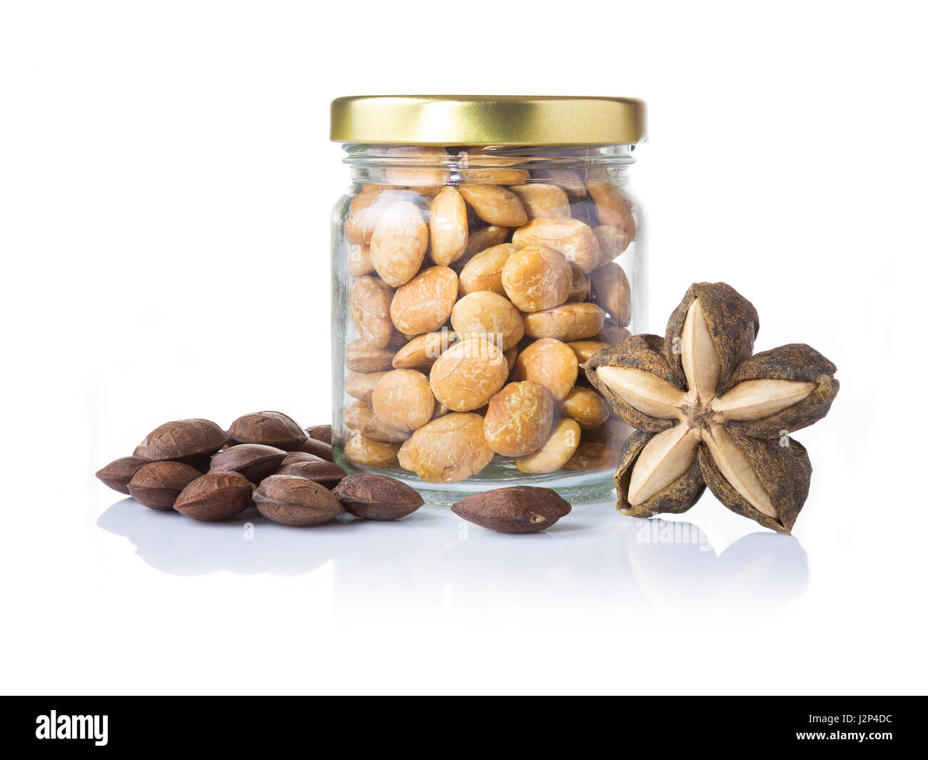 Sacha Inchi roasted seed nuts snack in clear glass bottle with golden ...
