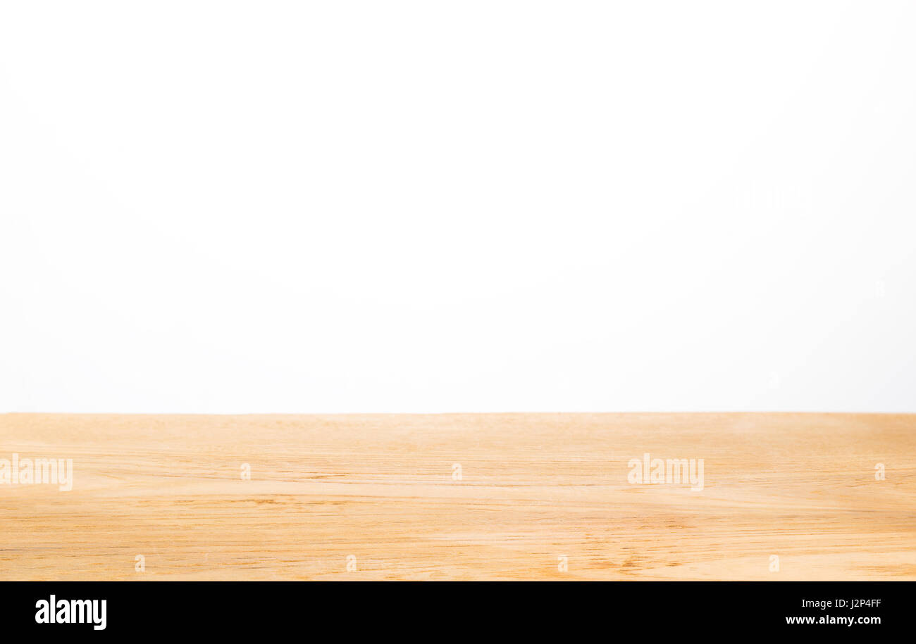 light color wood table top against white background, selective focus on ...