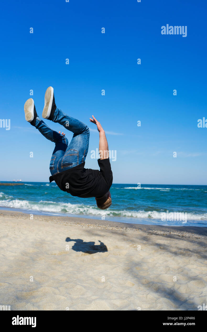 young parkour man doing flip or somersault Stock Photo - Alamy