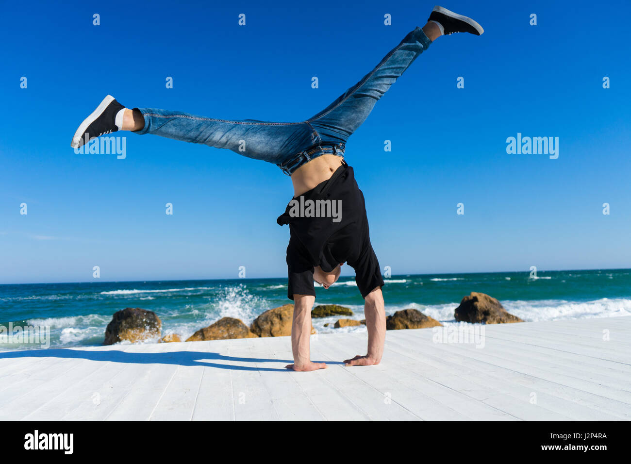 Hand stand beach hi-res stock photography and images - Alamy