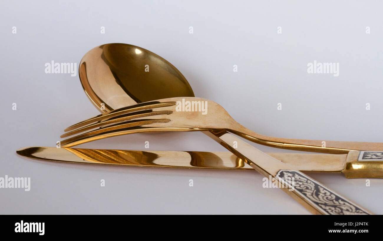 Thai gold knife, fork and spoon Stock Photo - Alamy