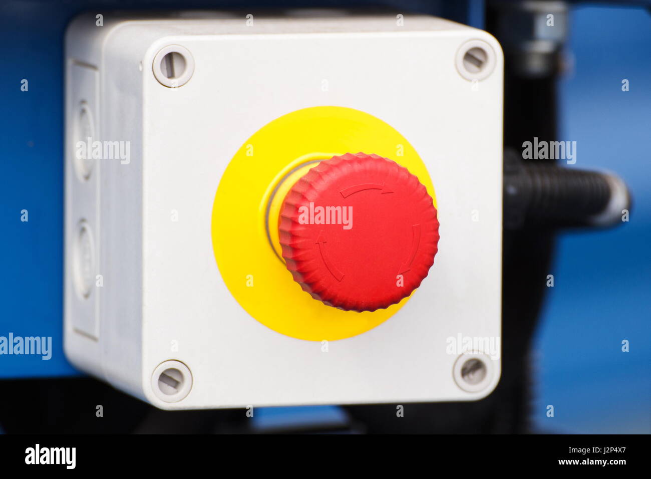 Emergency stop button for hand press on industrial machine, concept of ...