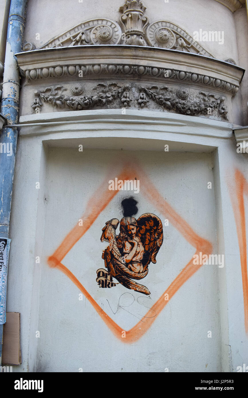 Inocent angel wall graffiti Stock Photo - Alamy