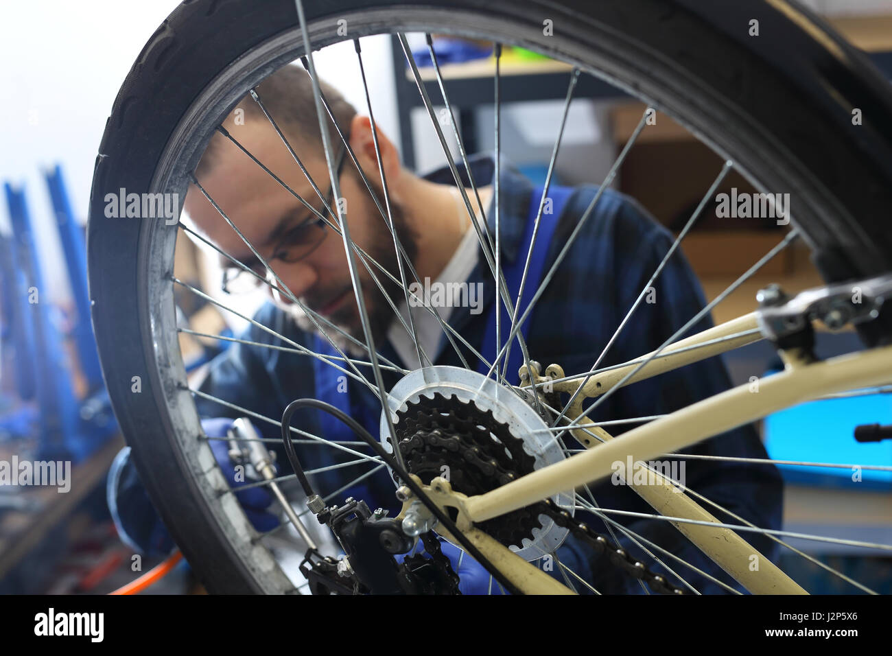 Pumping the bicycle wheel. Pumping the bike. The mechanic in the bike ...