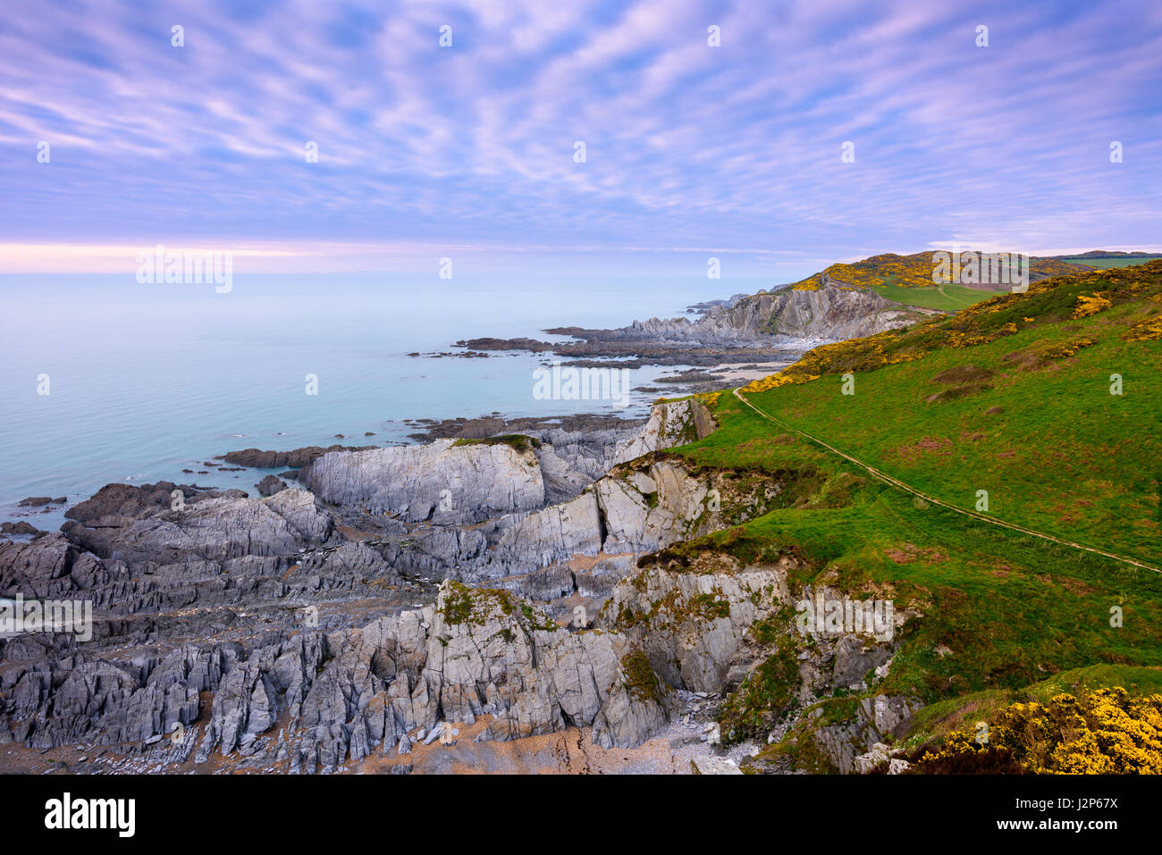 The rocky shore of North Devon Heritage Coast between Morte Point and ...