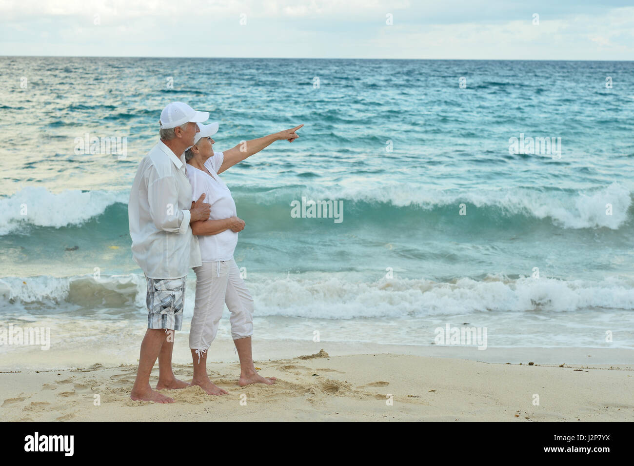 Elderly couple rest at tropical resort Stock Photo - Alamy