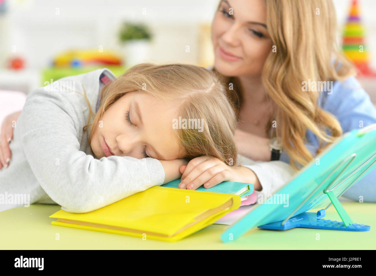 Mother and daughter study Stock Photo - Alamy