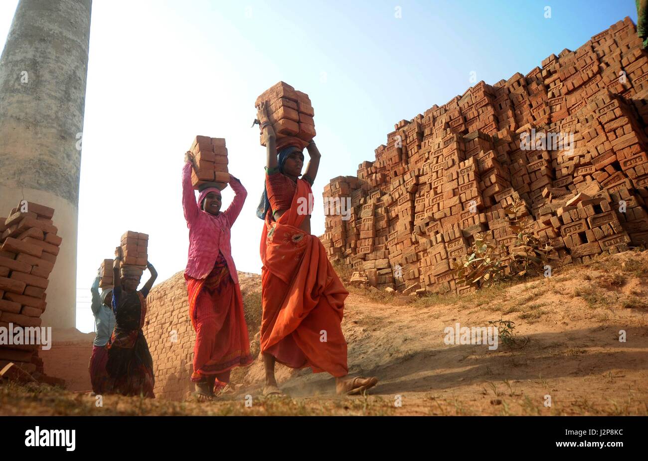 Indian labors working at a brick factory on the eve of International ...