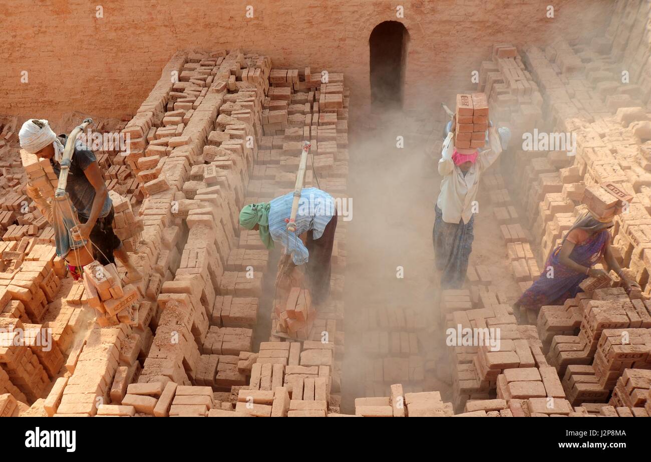 Indian labors working at a brick factory on the eve of International ...