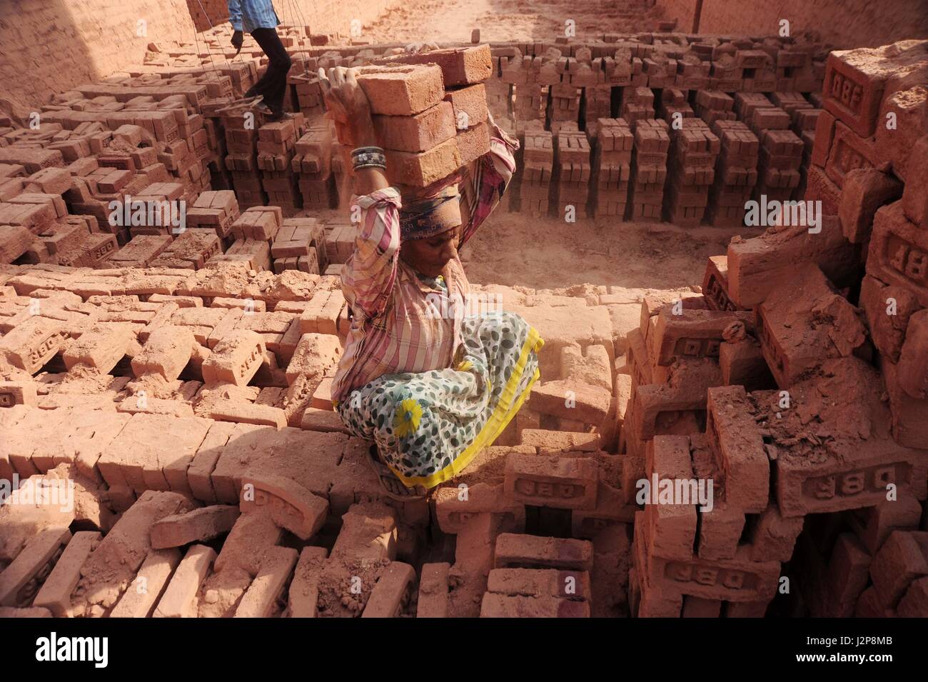 Indian labors working at a brick factory on the eve of International ...