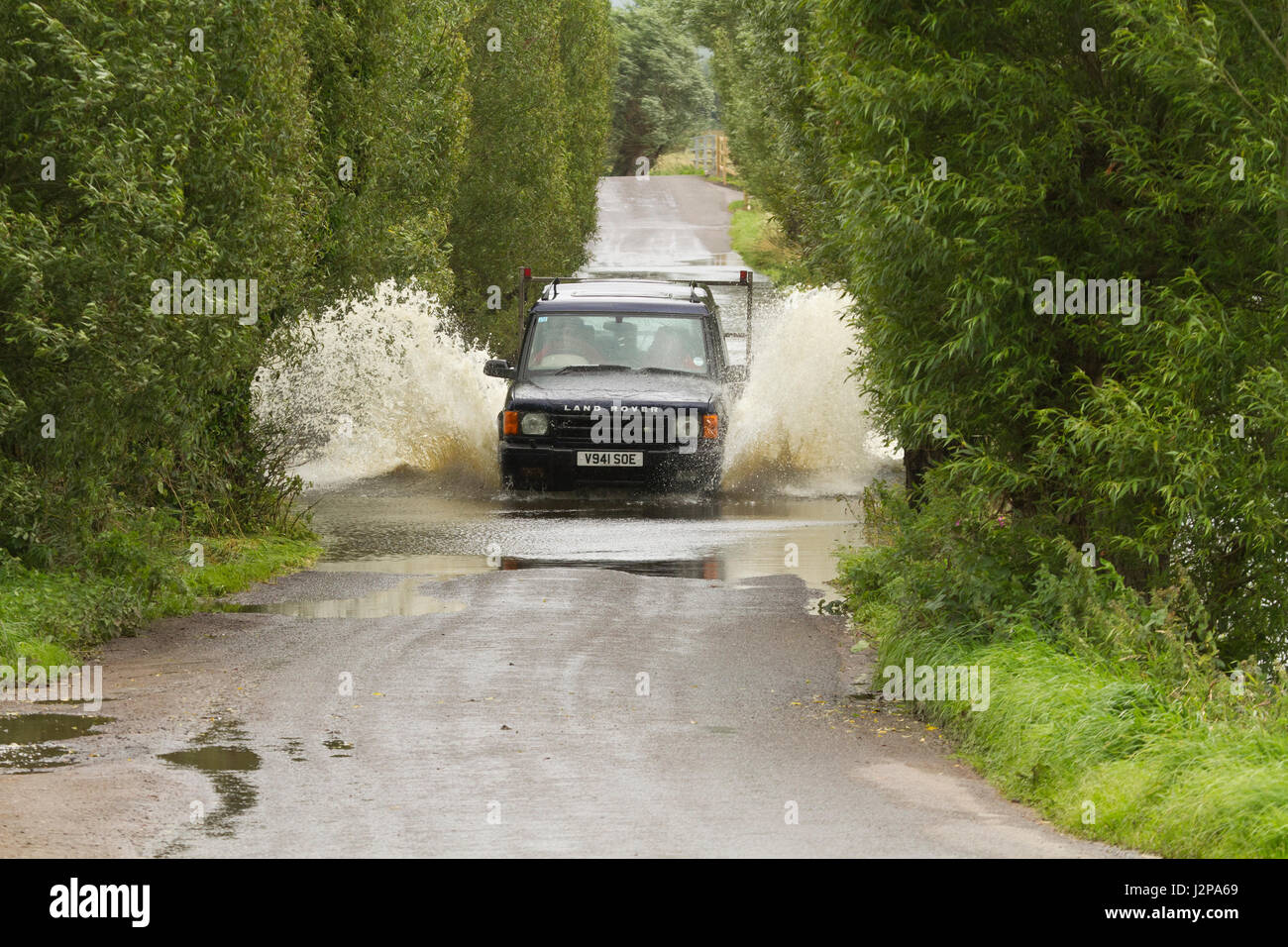 Vehicles Driving Through Water High Resolution Stock Photography and ...