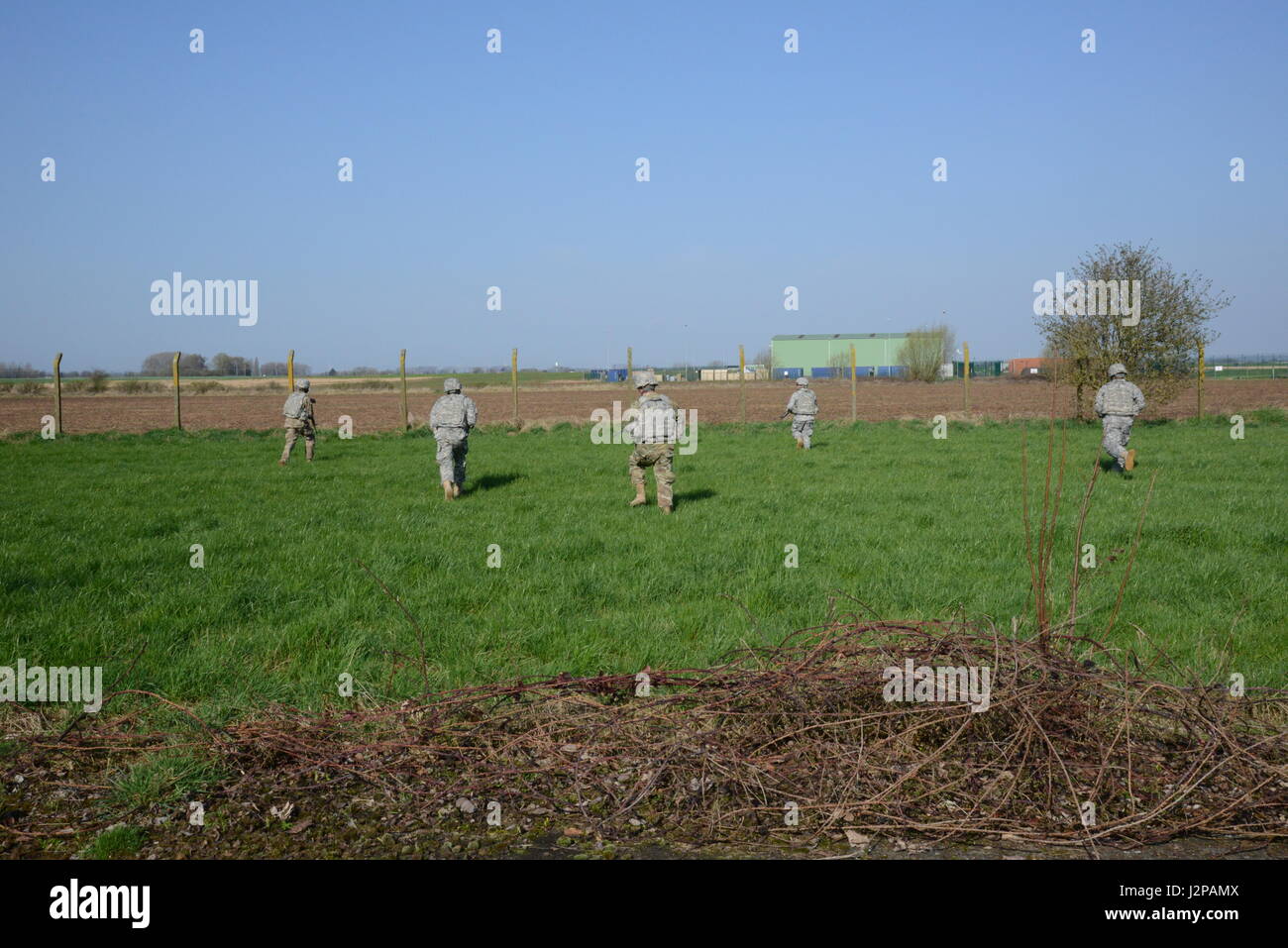 U.S. Soldiers of 39th Signal Battalion, move to a safe location in ...