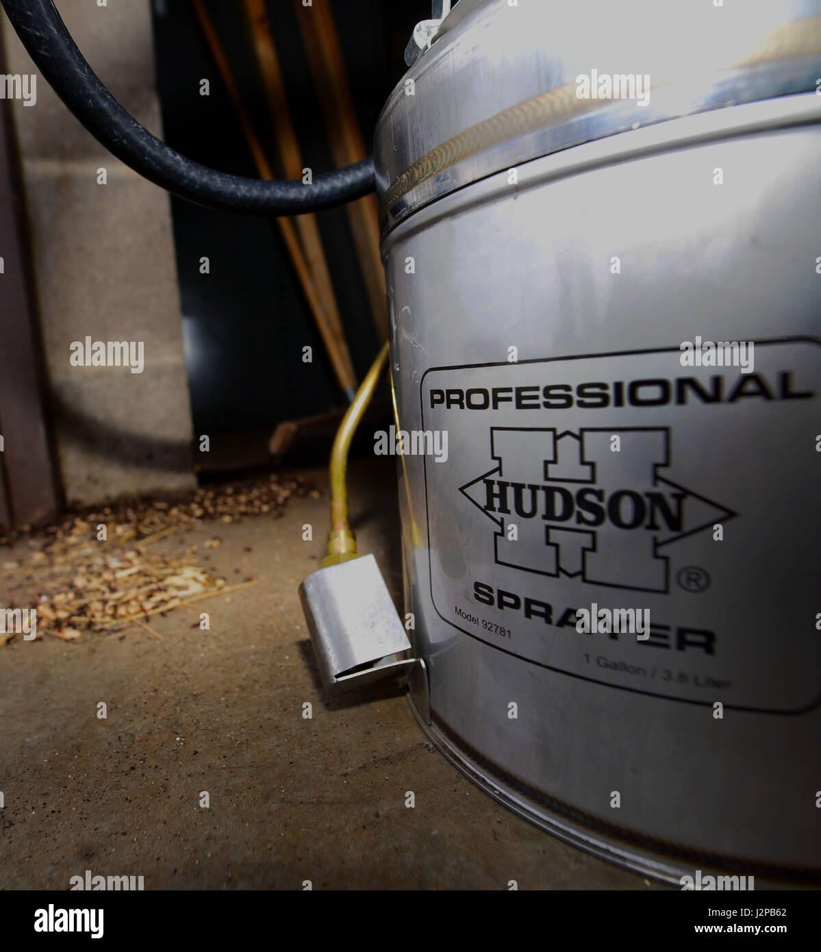 A Hudson one gallon sprayer is prepared for an ant infestation inside ...