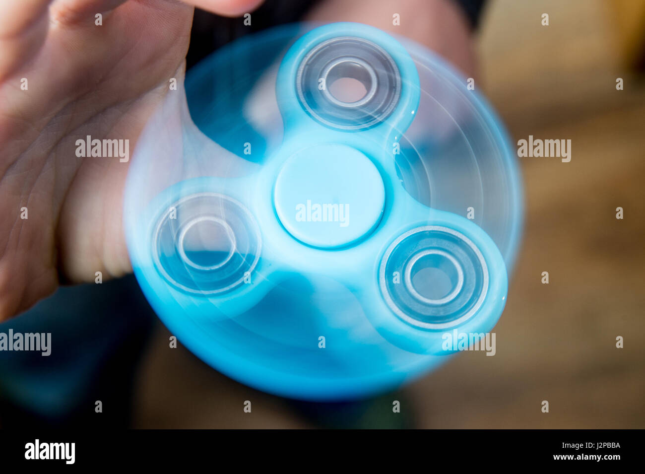 Sunday 30 April 2014 Pictured: A young boy uses a bright blue fidget ...