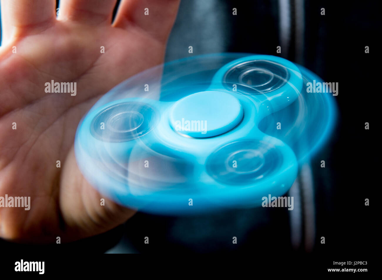 Sunday 30 April 2014 Pictured: A young boy uses a bright blue fidget ...