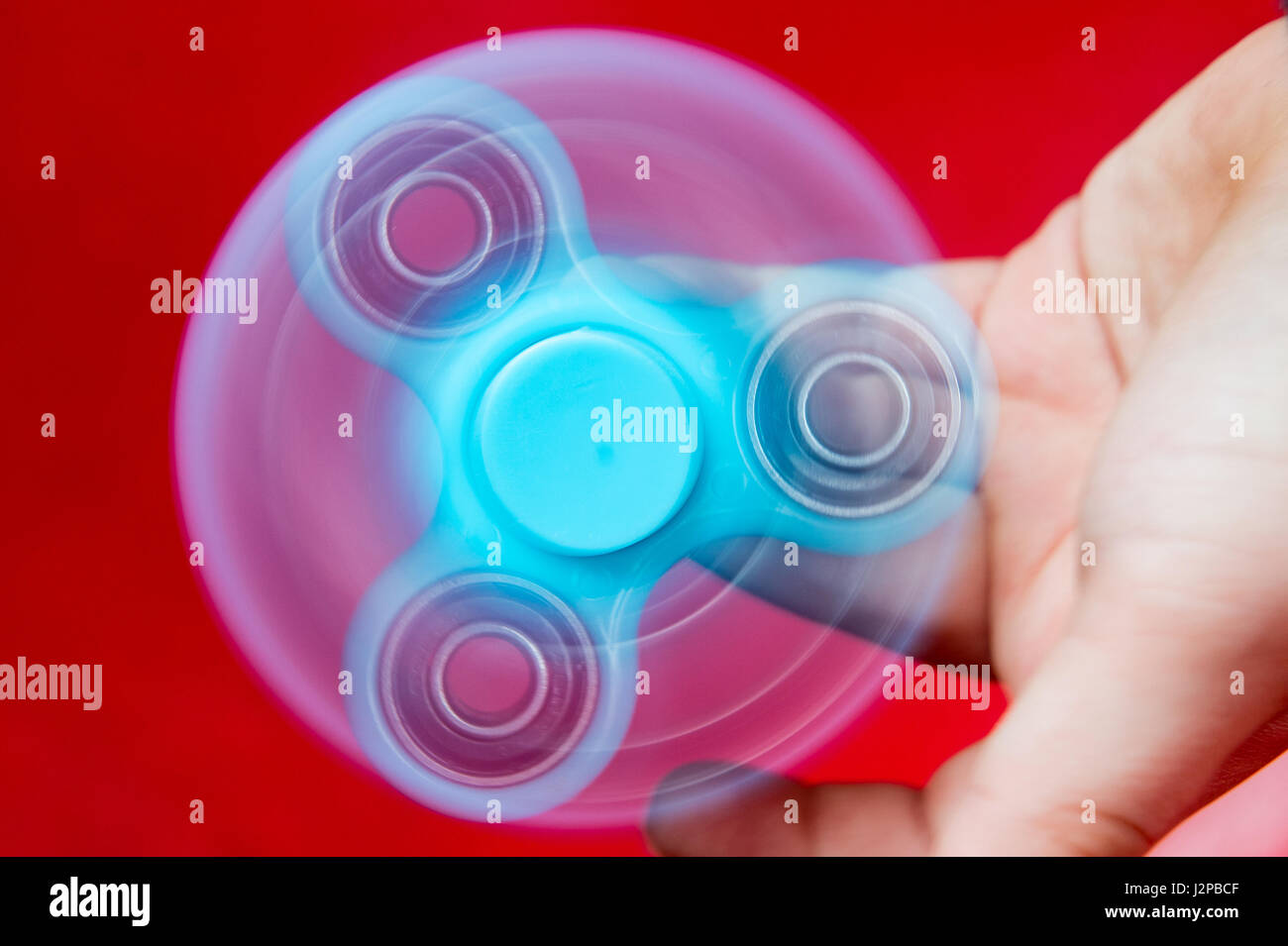 Sunday 30 April 2014 Pictured: A young boy uses a bright blue fidget ...