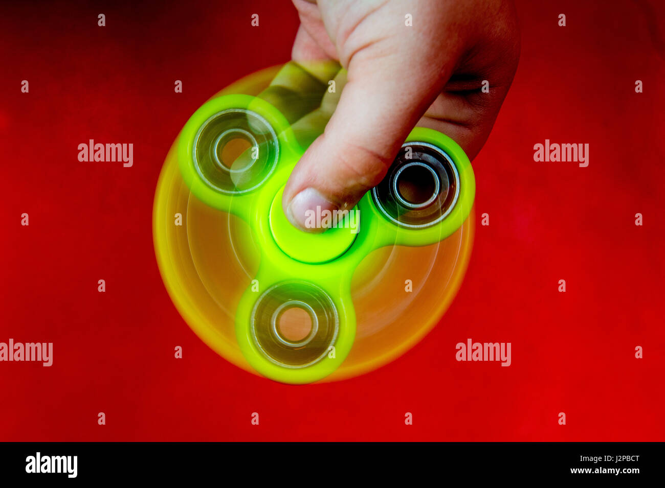 Sunday 30 April 2014 Pictured: Bright Green fidget spinner in use over ...