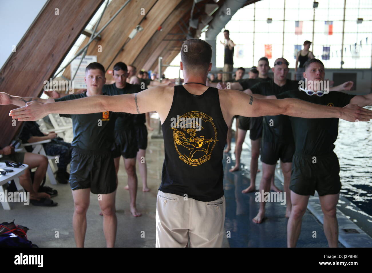 U.S. Marine Corps Staff Sgt. Daniel Coleman, center, Staff Non ...