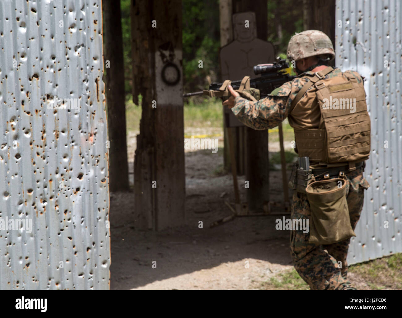 A Marine enters a shelter with multiple hidden targets during a sniper ...