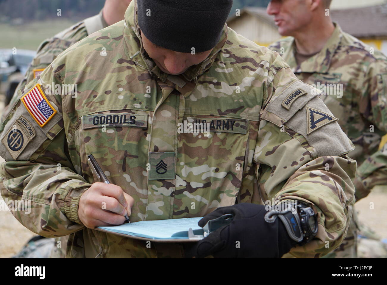 A Soldier from 7th Army Training Command grades a Soldier's weapons ...