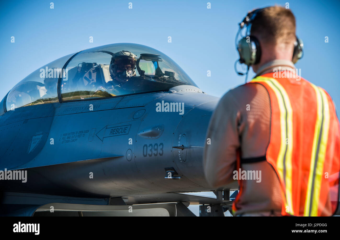 Airmen from the 388th Maintenance Squadron guide an F-16 Fighting ...