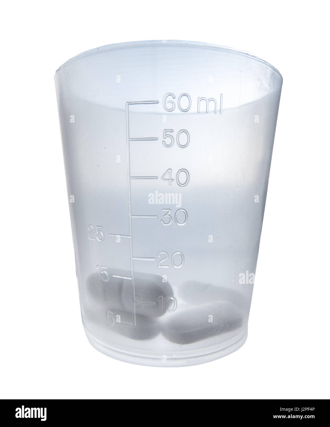 Isolated Medicine In A Plastic Medical Measuring Cup Stock Photo - Alamy