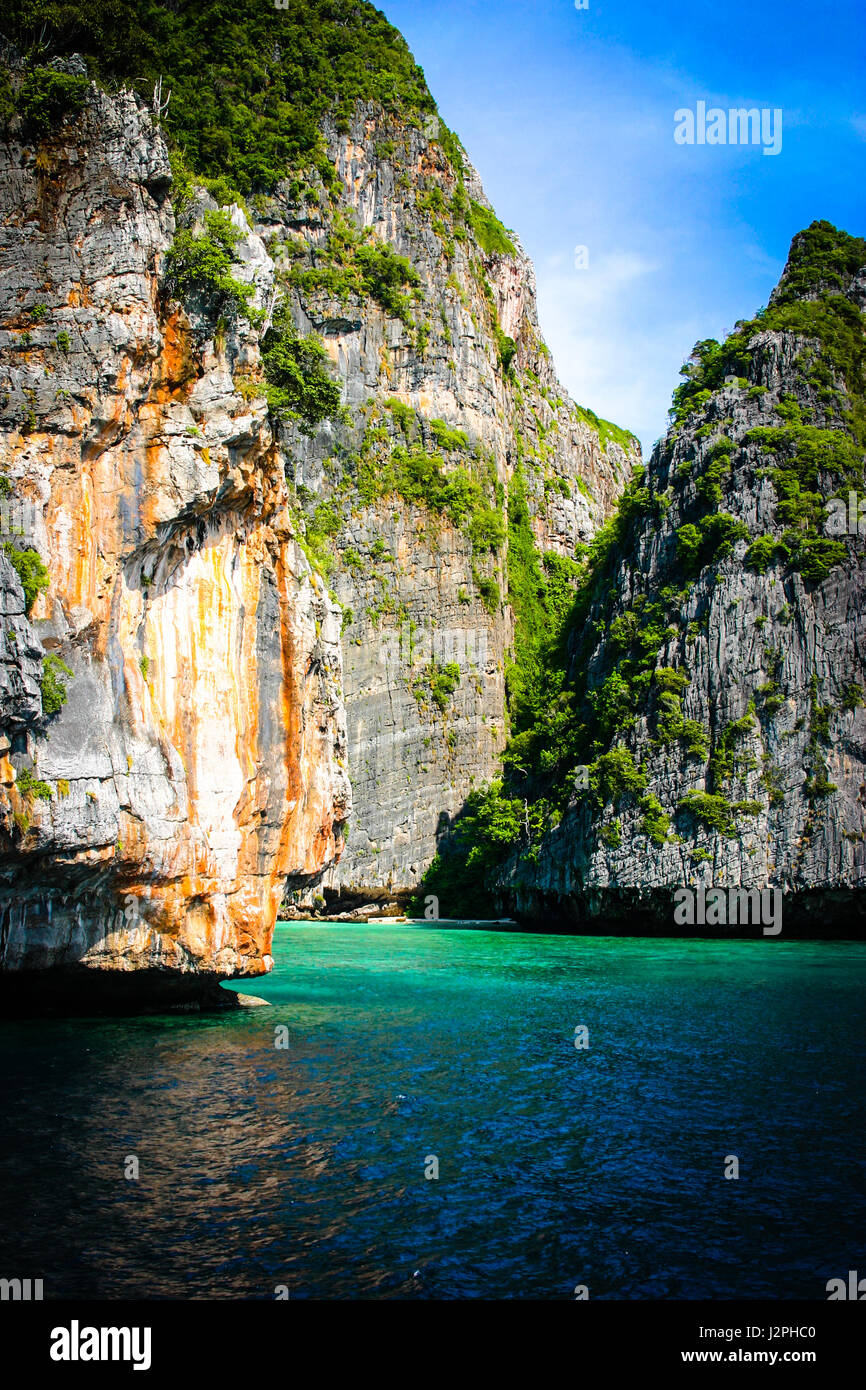 Great and large rocks in the ocean. Small islands with green forest and ...