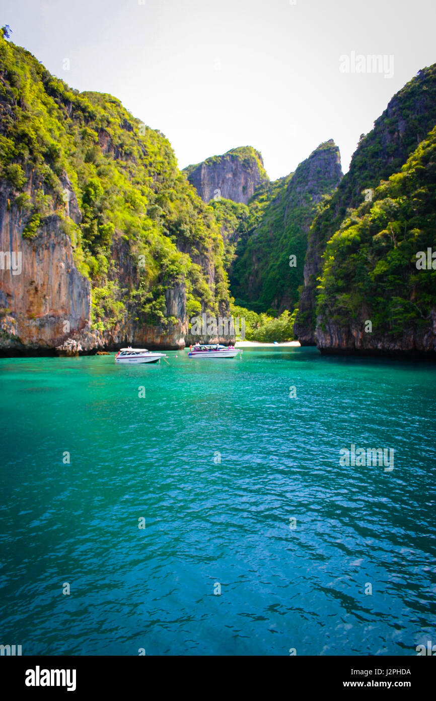 Great and large rocks in the ocean. Small islands with green forest and ...