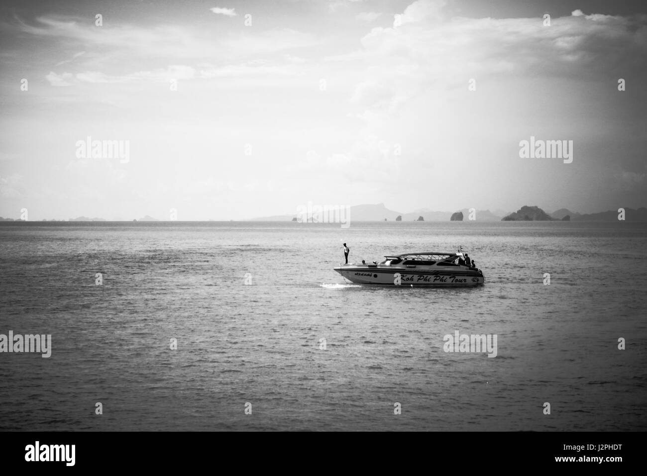 A boat close to the island Stock Photo - Alamy