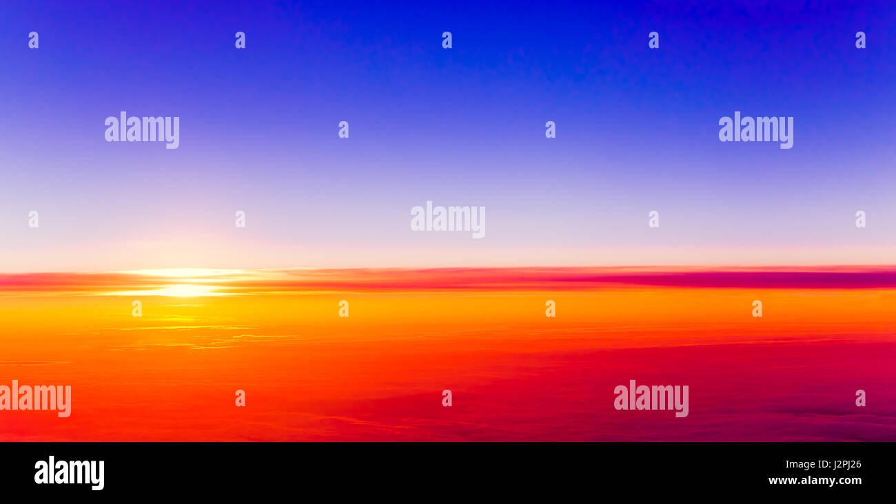 Dramatic sunset. View of sunset above clouds from airplane window Stock ...